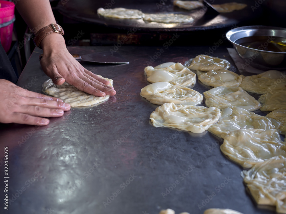 Roti Making, roti thresh flour by roti maker with oil. Indian ...