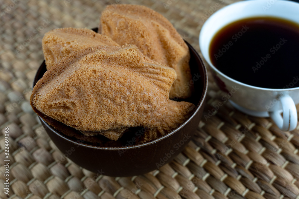 Traditional Malaysian cake called "kuih bahulu or baulu" in fish shape ...