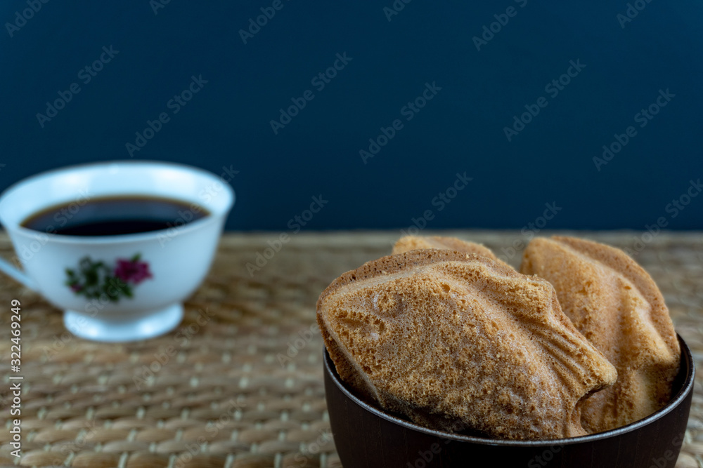 Traditional Malaysian cake called "kuih bahulu or baulu" in fish shape ...
