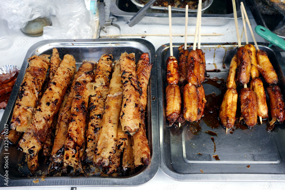 Deep fried Saba banana in spring roll wrapper and bananacue with brown ...