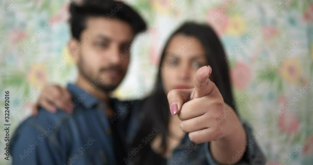 Two mid-shot of a smiling confident Indian couple together smiling ...