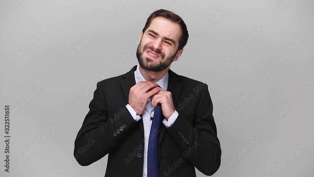Tired bearded business man in classic black suit shirt posing isolated ...