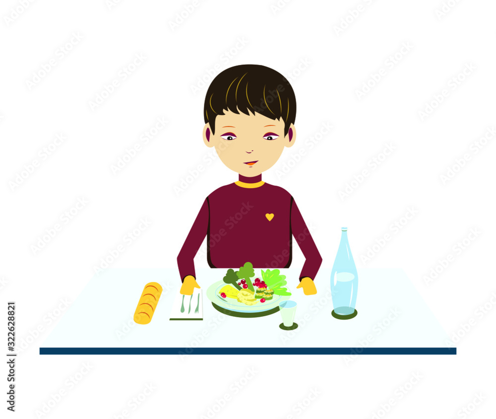 Young Boy eating vegetables pasta and bread on the table for lunch ...