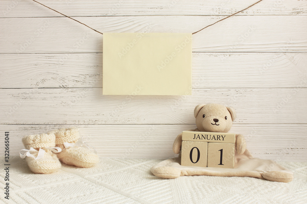 Calendar. January 1th. Day 1th of month. Teddy bear holding wood cube ...