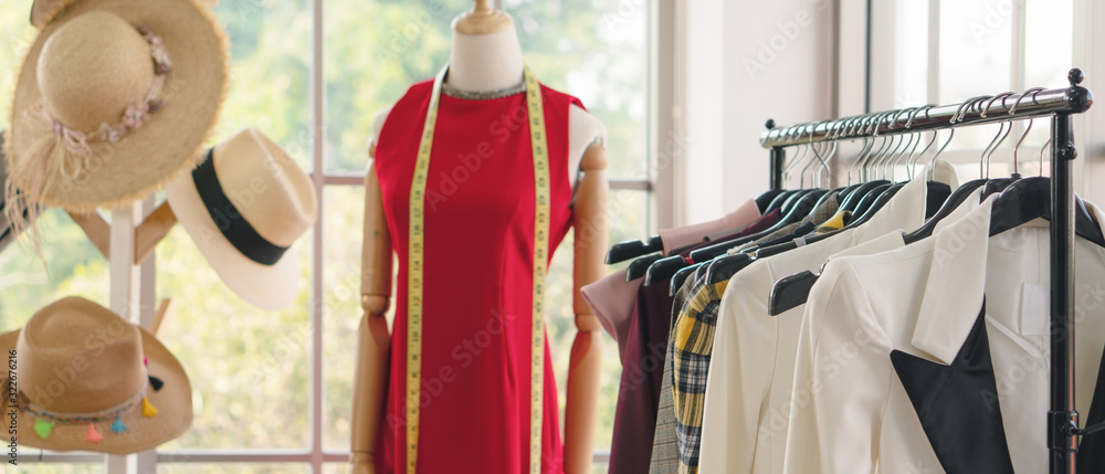 woman cloth hanging on rack to show at fashion retail store Stock Photo ...