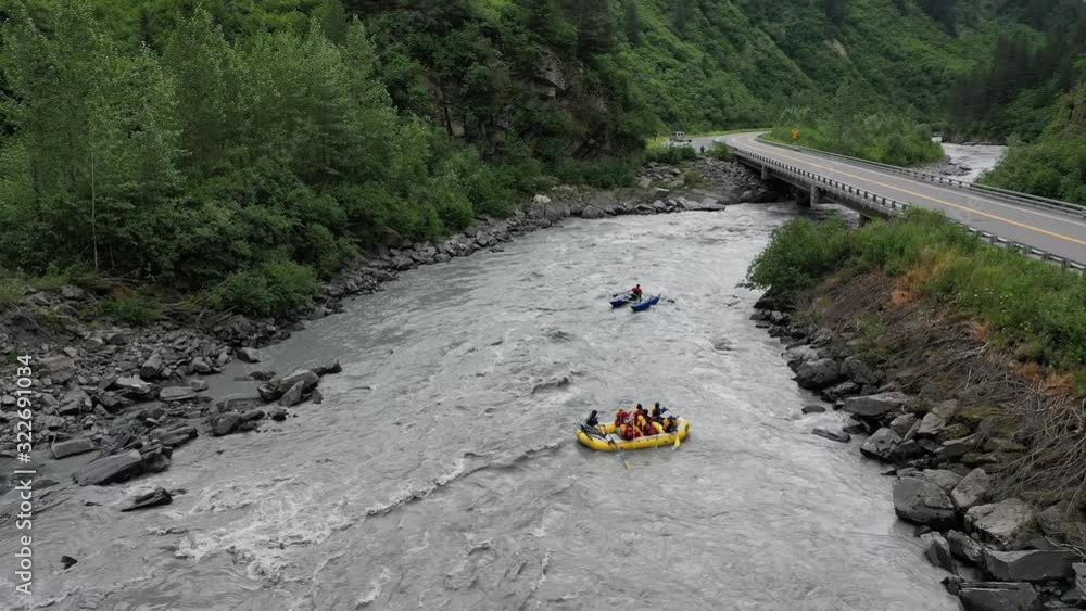 River raft sideways going down a raging river as they prepare to go ...