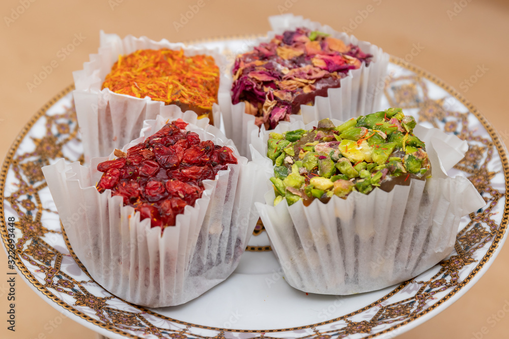 Four cubes of fruit delight of different tastes on a saucer, tra Stock ...