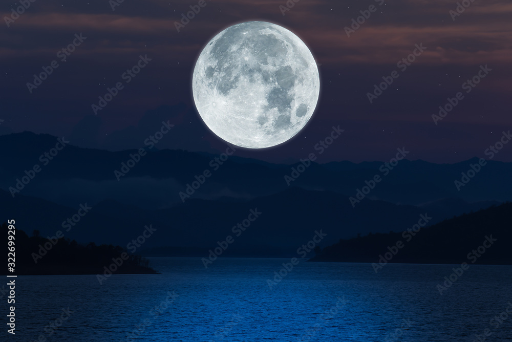 Full moon over lake at night. Stock Photo | Adobe Stock