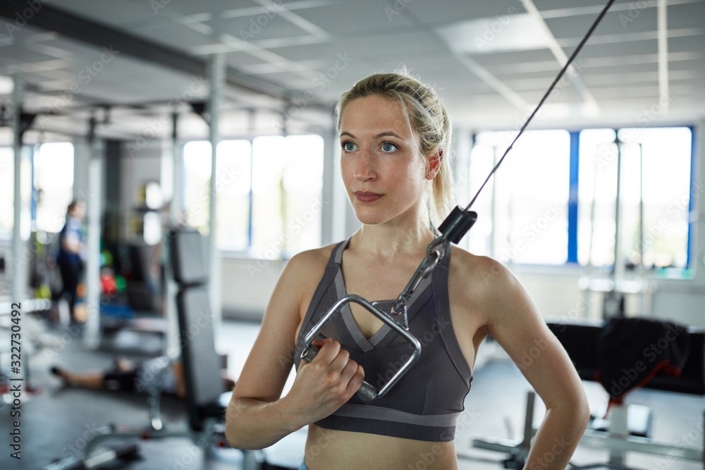 Woman in fitness center at train station Stock Photo | Adobe Stock