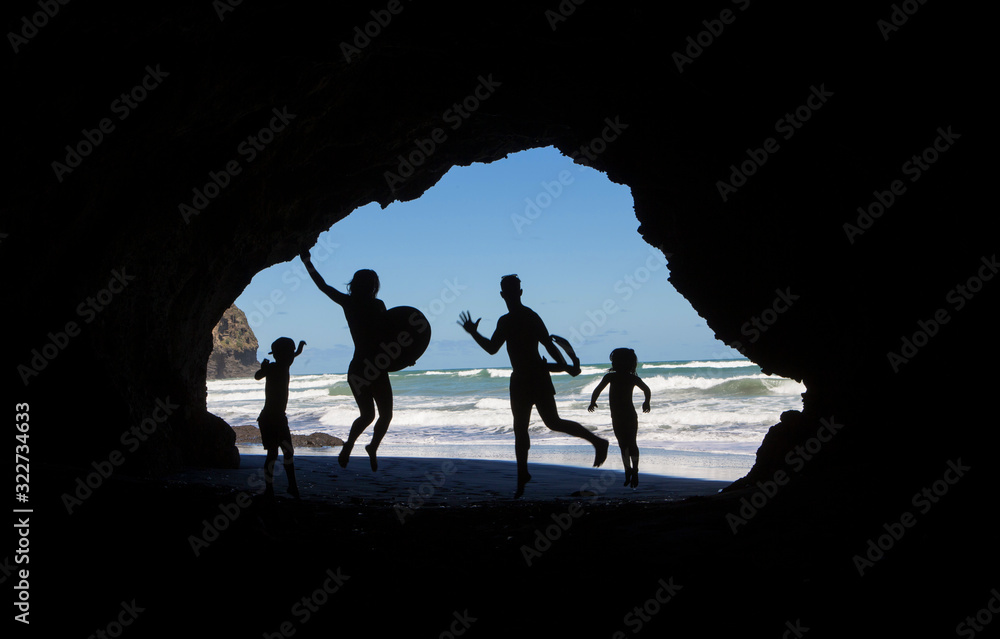 Fun at the beach. Jumping in a cave. Bethells beach Auckland New ...