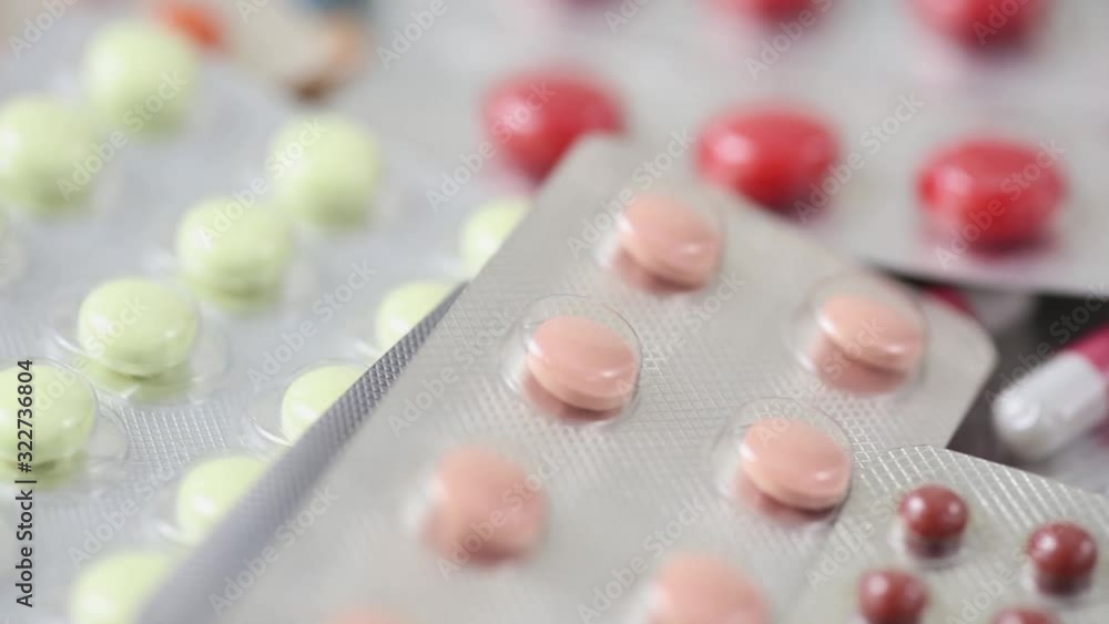 Seamless closeup loop of colorful medication in blisters Stock Video ...