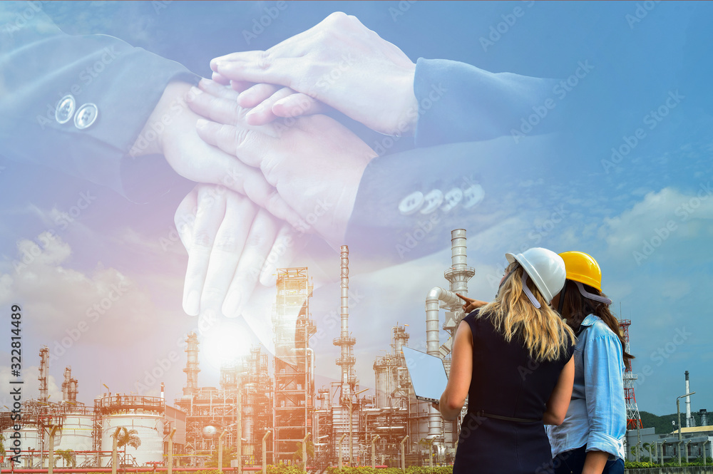Oil Refinery discussion and pointing for inspection by hand holding ...