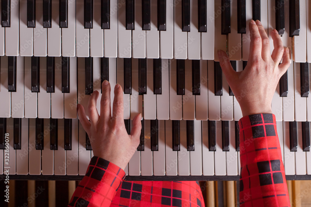 Organist playing a pipe organ, Top view Stock Photo | Adobe Stock