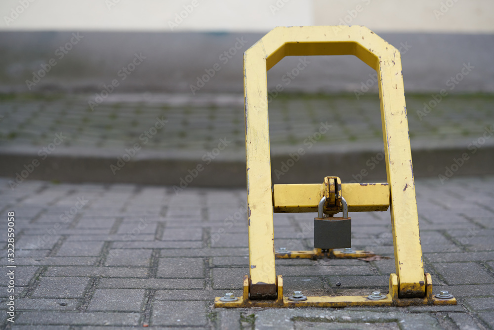 Manual car parking barrier with lock and stop sign. Car parking lock ...