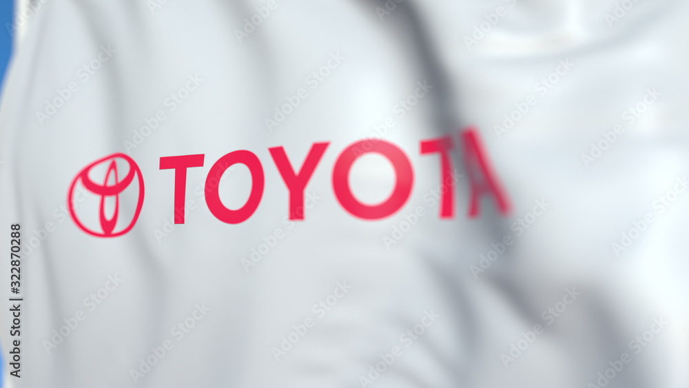 Waving flag with Toyota Motor Corporation logo, close-up. Editorial 3D ...