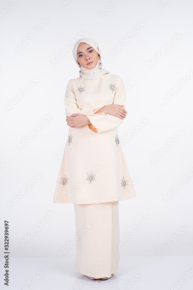 Beautiful female Muslim model in various poses wearing kurung Pahang ...