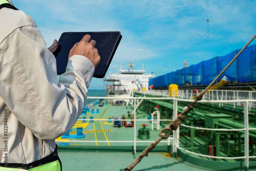 crew worker on oil tanker ship and hand holding tablet,Ipat on green ...