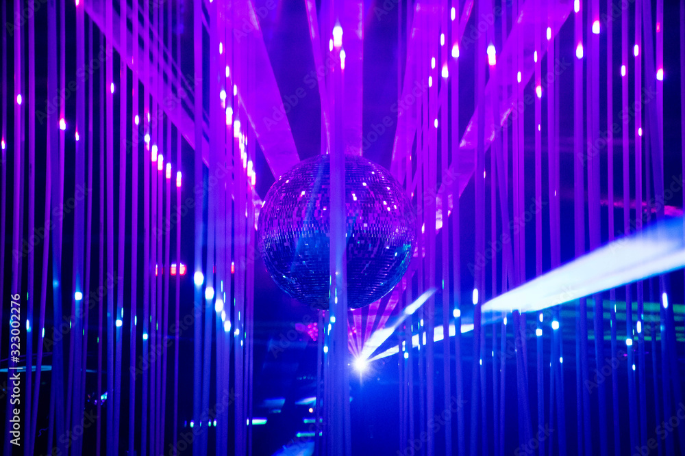 Dance floor disco night with a mirror ball symbol of fun and party in a ...