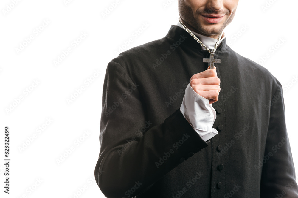 cropped view of catholic priest showing holy cross on his necklace ...