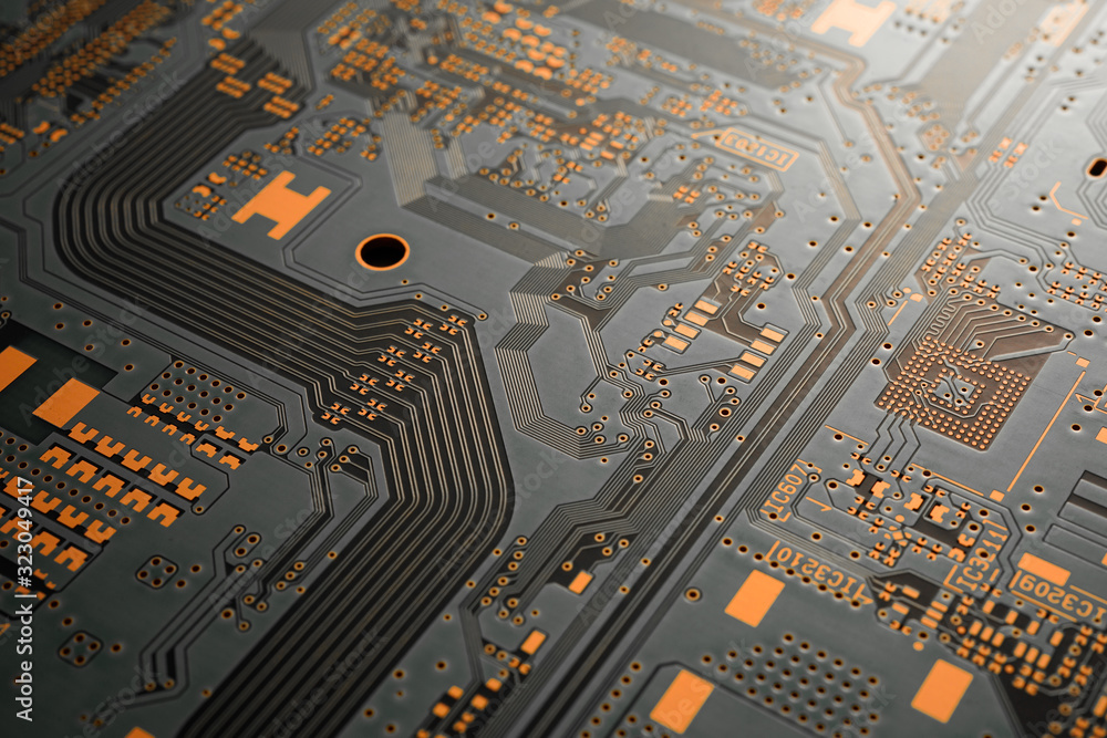 A close-up of black blank Printed circuit board (PCB) with no component ...