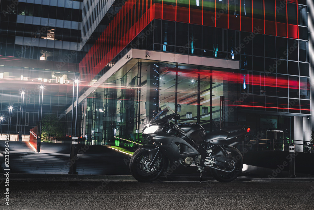 Motorcycle in front of an office building Stock Photo | Adobe Stock