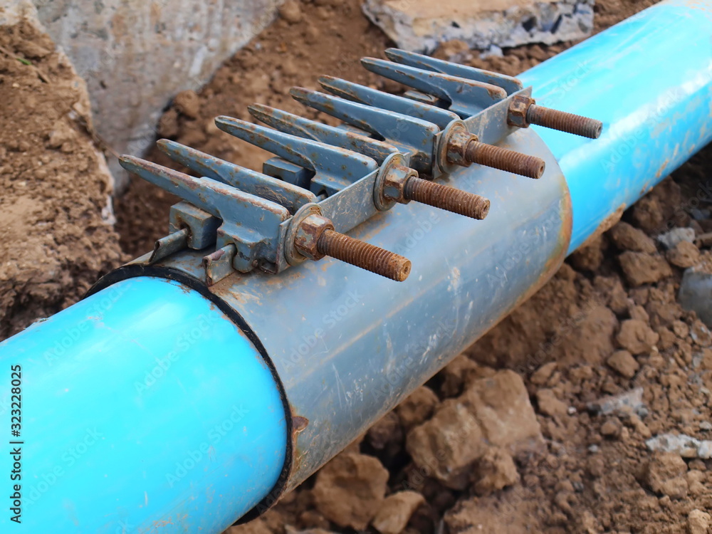 Repair broken pipes with repair clamp. Repair metal casing at the blue ...
