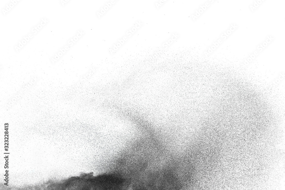 Black powder explosion against white background.Charcoal dust particles ...