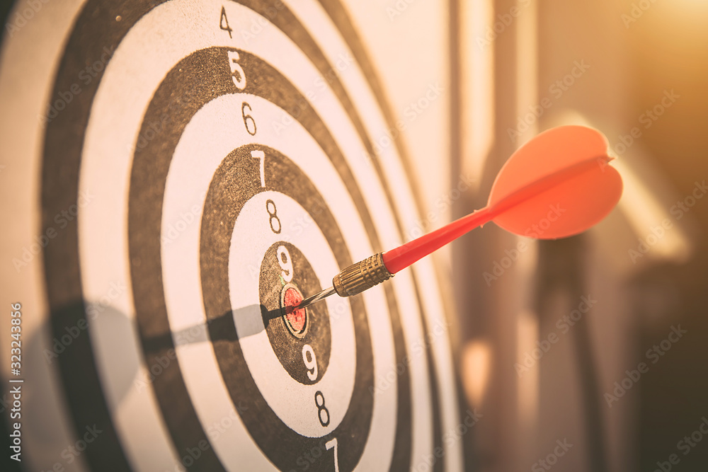 Close up red color arrow in the center of Bullseye or bull's-eye for ...