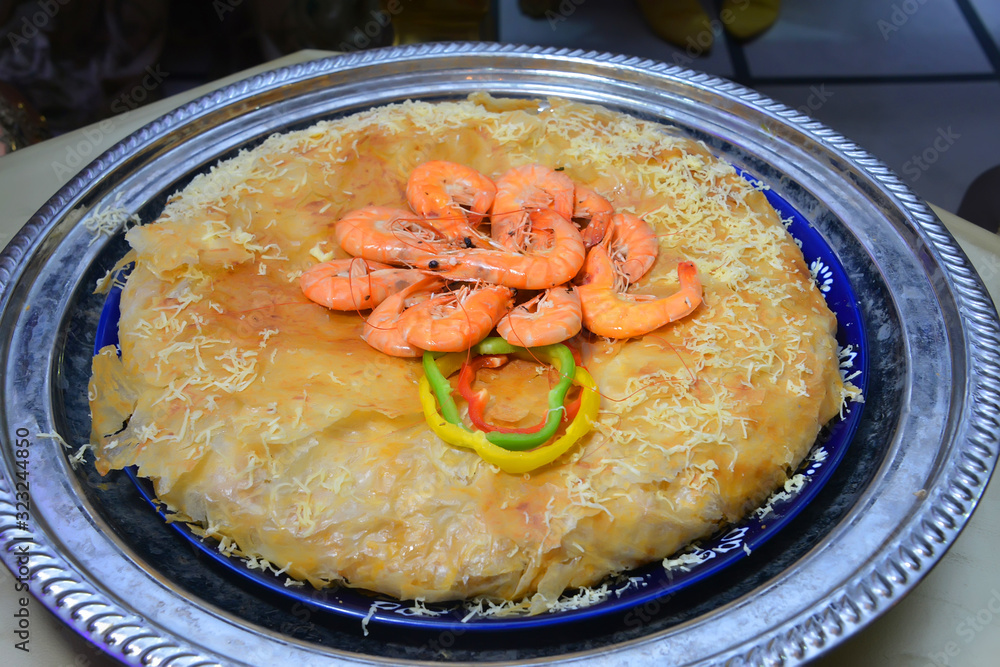 fish pastilla, Moroccan layered pie, top view . Stock Photo | Adobe Stock
