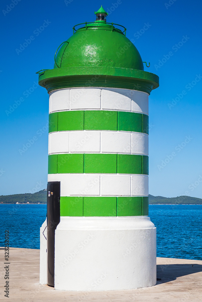 Green striped lighthouse Stock Photo | Adobe Stock