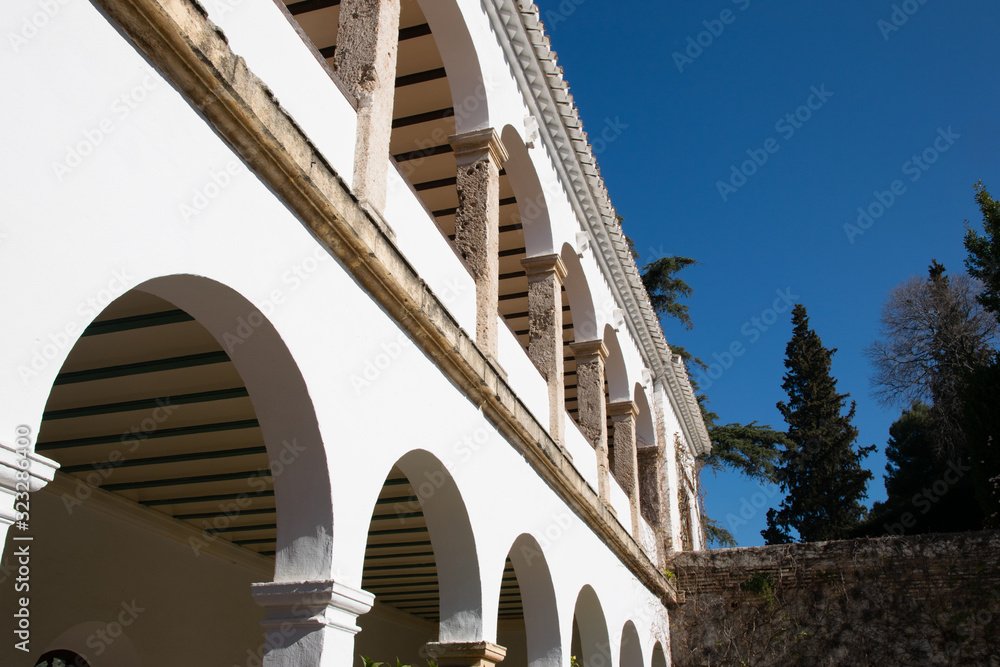 Arabic architectural details in columns and arches of a mosque or an ...