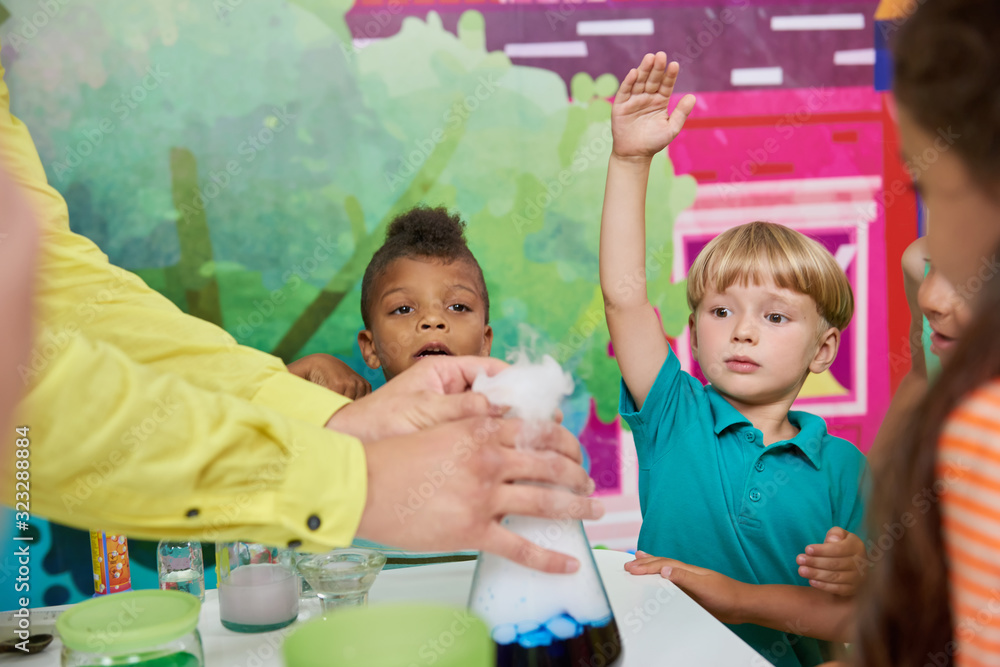 Science show for kids. Happy children doing chemical experiments in ...