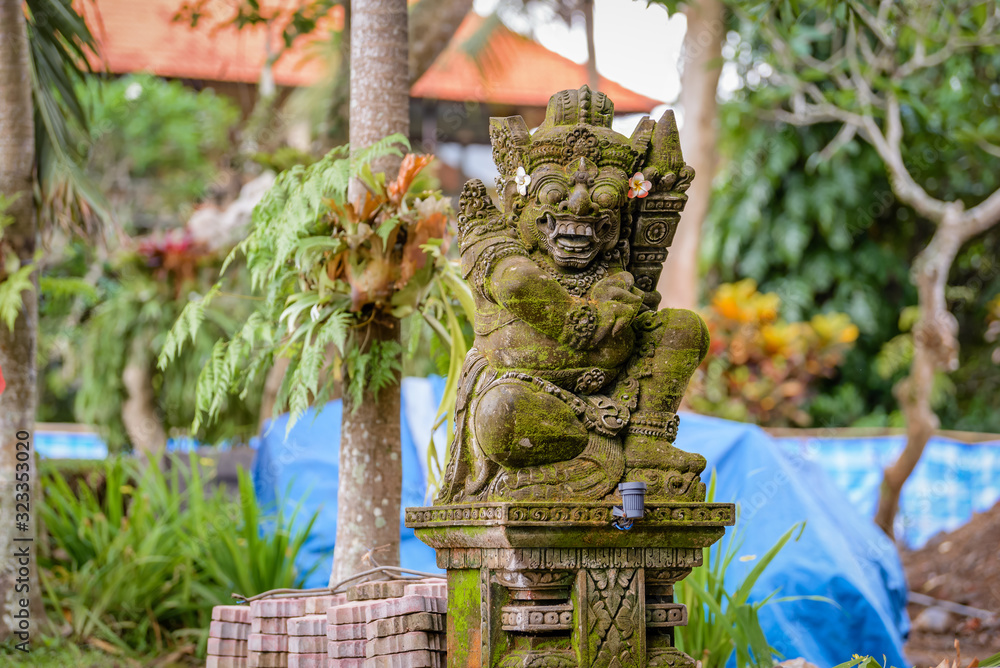 Balinese sculptures and traditional architectural details in a temple ...