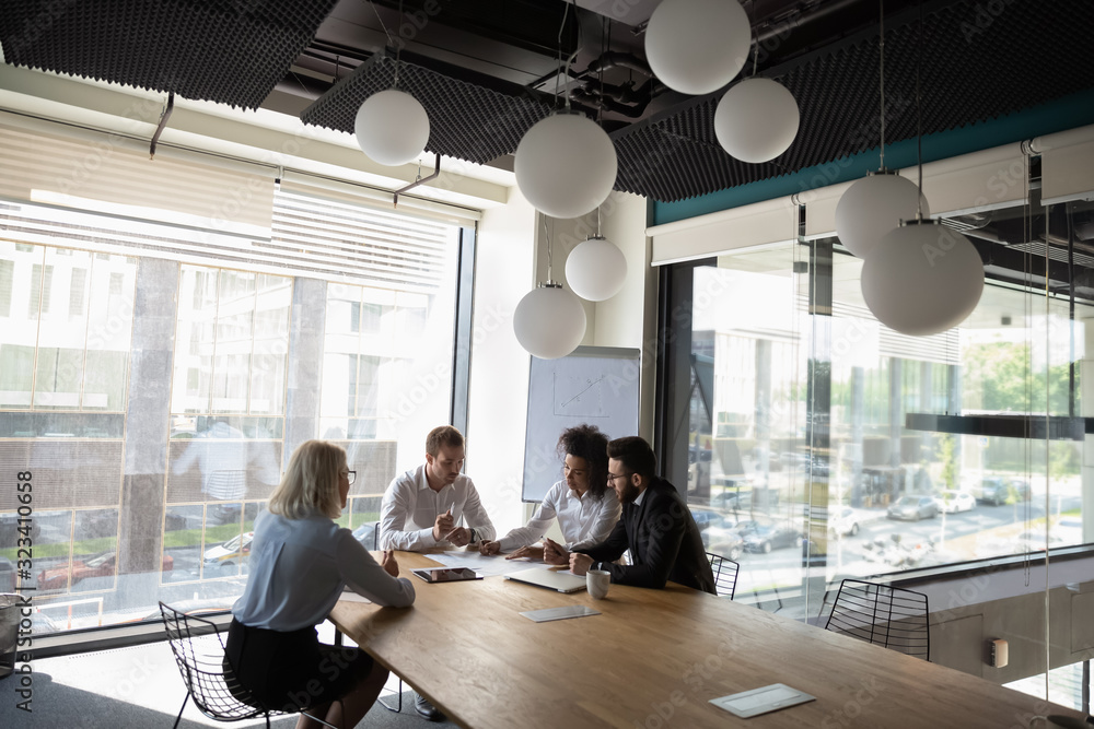 Multi-ethnic office workers strategizing thinking on problem solution ...