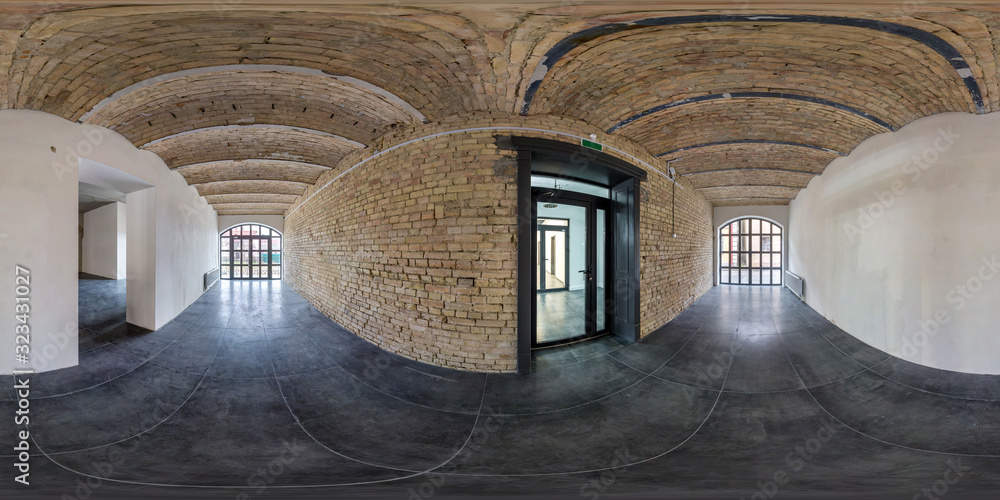 empty room without furniture with big panoramic windows and brick wall ...