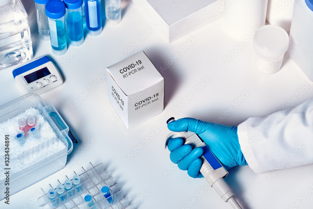 Novel coronavirus 2019 nCoV pcr diagnostics kit. Hand in glove with ...
