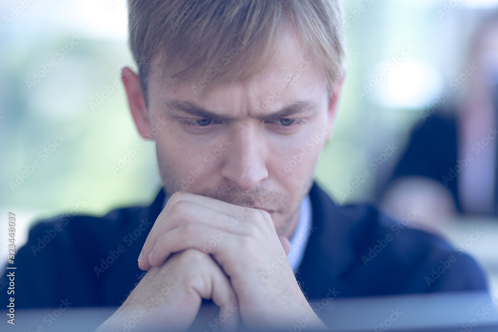 Selective focus, A businessman wearing suit sitting in front of a ...