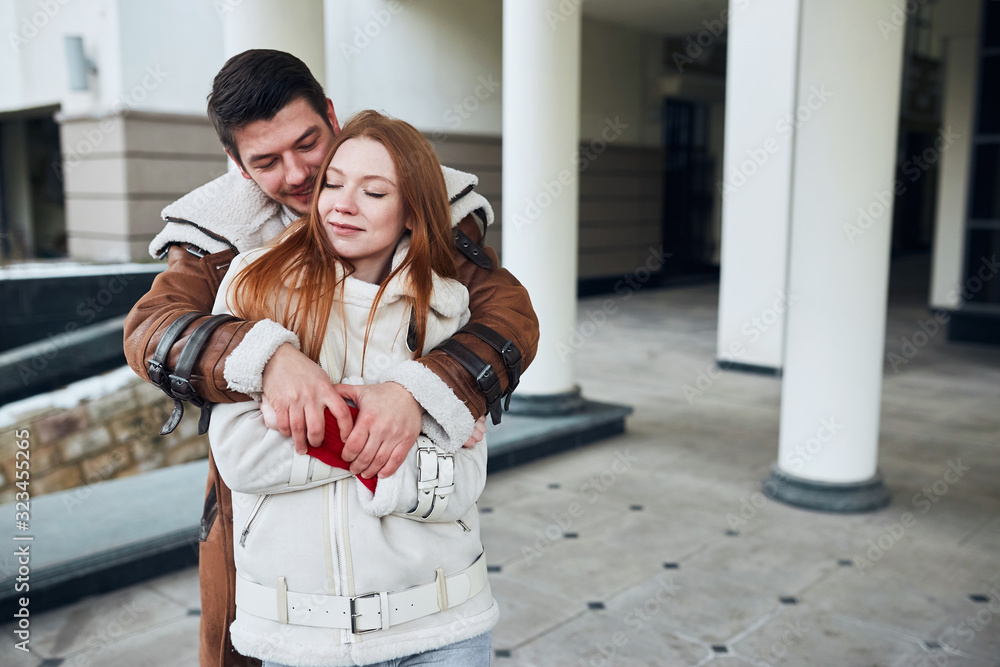 amorous couple flirting in the street. care concept. I love you ...