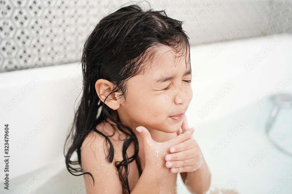 Kid bathing and showering in the bathroom.skin and care concept. Stock ...