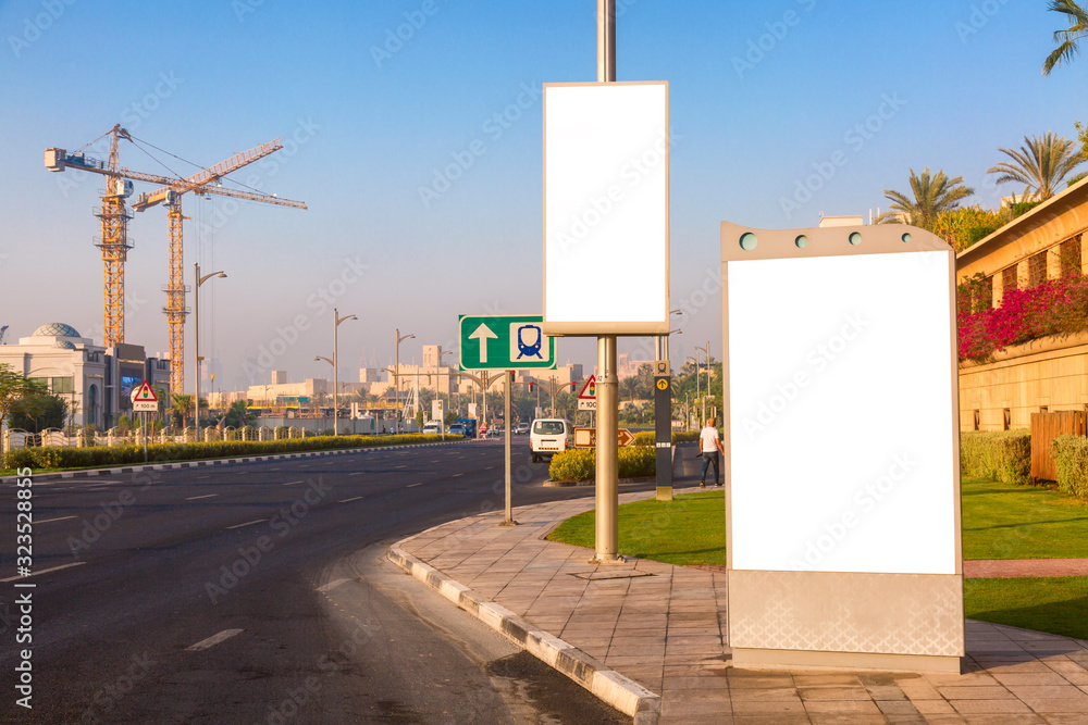 Advertisement mockup. Blank empty billboards on the city street in ...