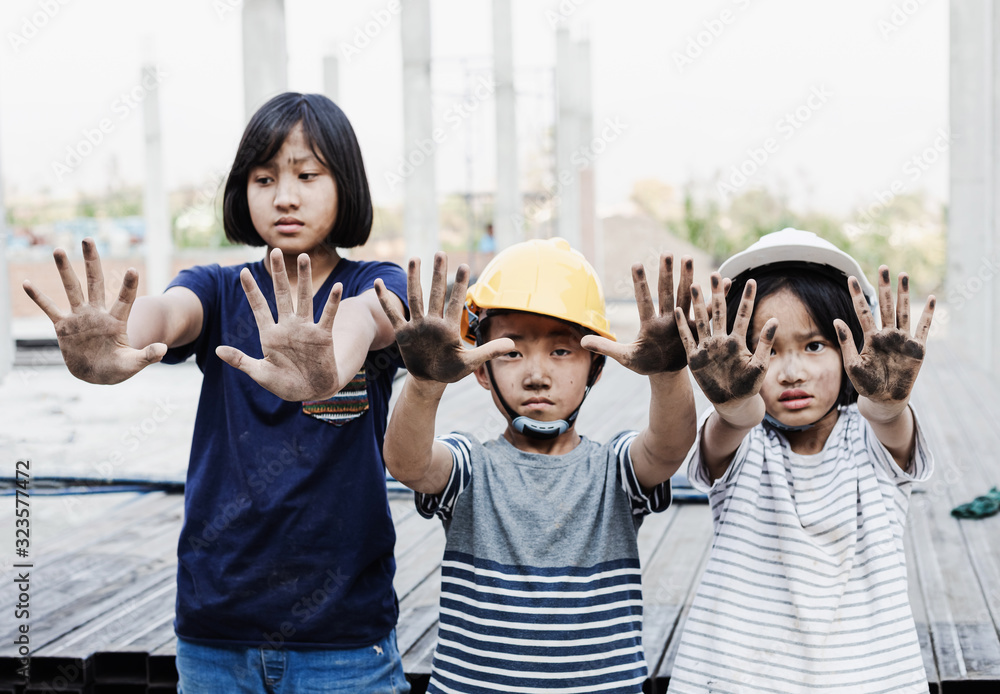 World day against child labour concept. dirty hands of children from ...