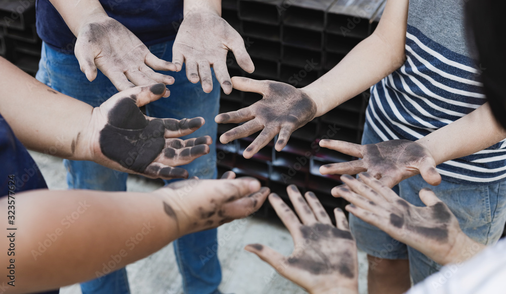 World day against child labour concept. dirty hands of children from ...