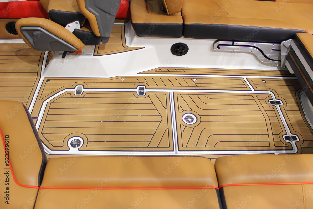 Open luxury motor boat cockpit brown interior with marine teak floor ...
