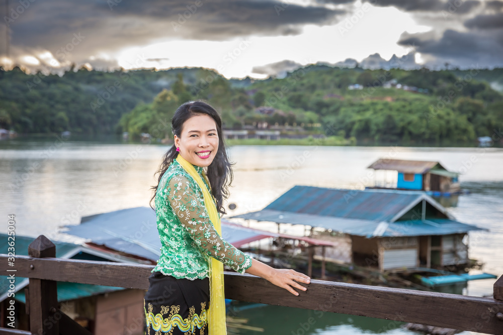 Thai women get dress traditional costume of Mon tribal at Mon village ...