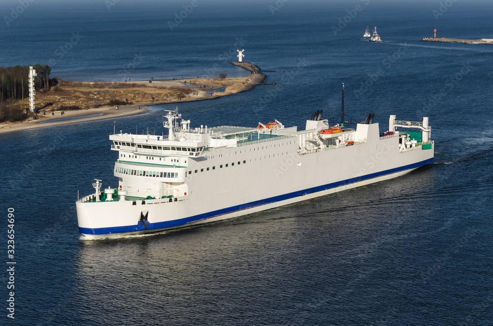 PASSENGER FERRY - The white ship flows through port channel to terminal ...