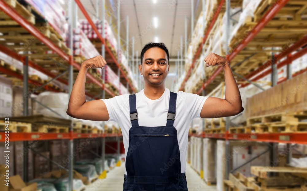 logistic business and people concept - happy smiling indian loader or ...