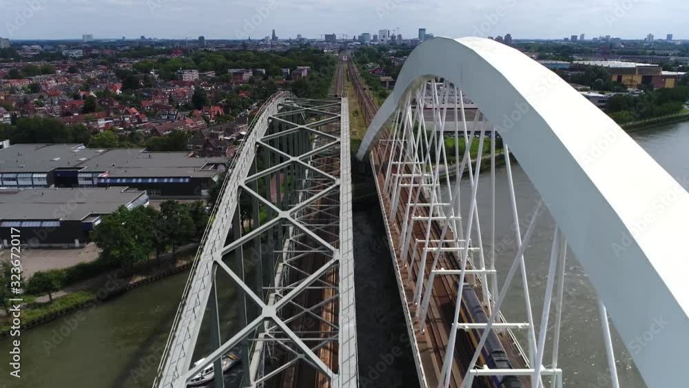 Aerial view flight over tied-arch bridge is infrastructure in which ...