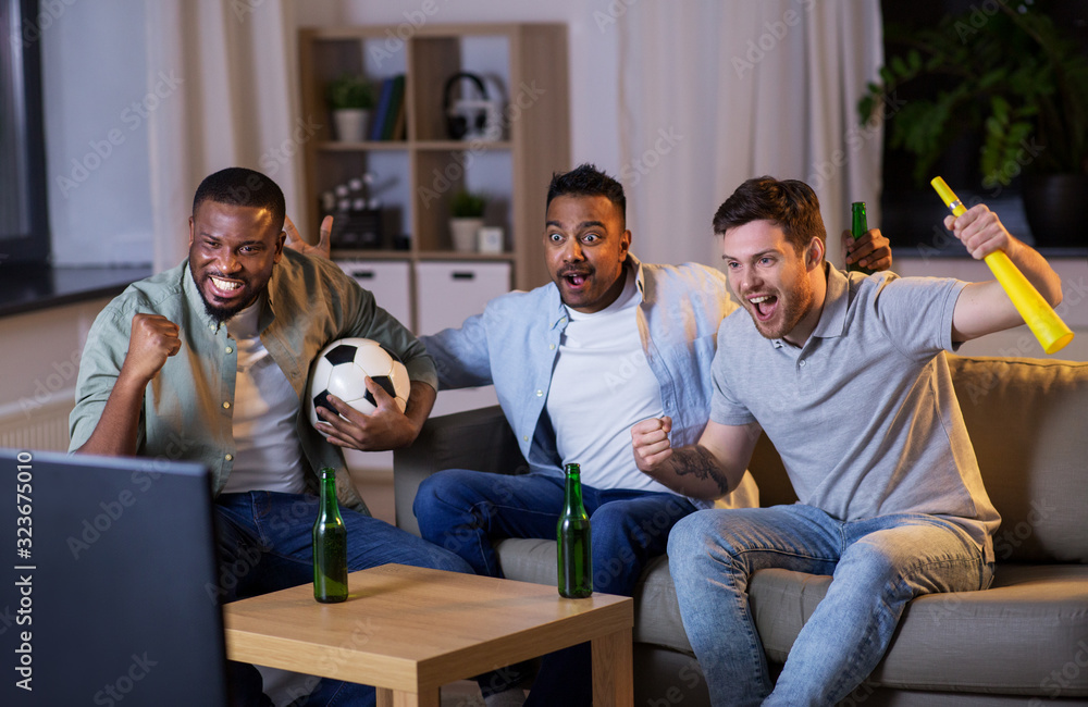 friendship, sports and entertainment concept - happy male friends with ...