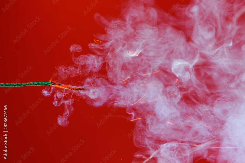 Burning fuse wick dynamite of fireworks cord with sparks and smoke on ...