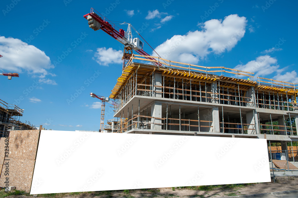 Blank white banner for advertisement on a fence of a building under ...